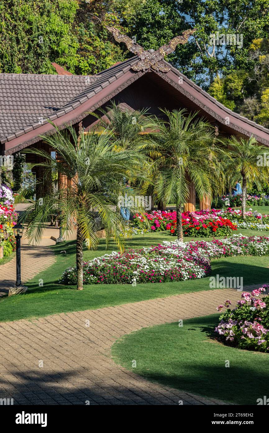 Palm trees and flower gardens enhance the Lanna and Swiss architecture ...