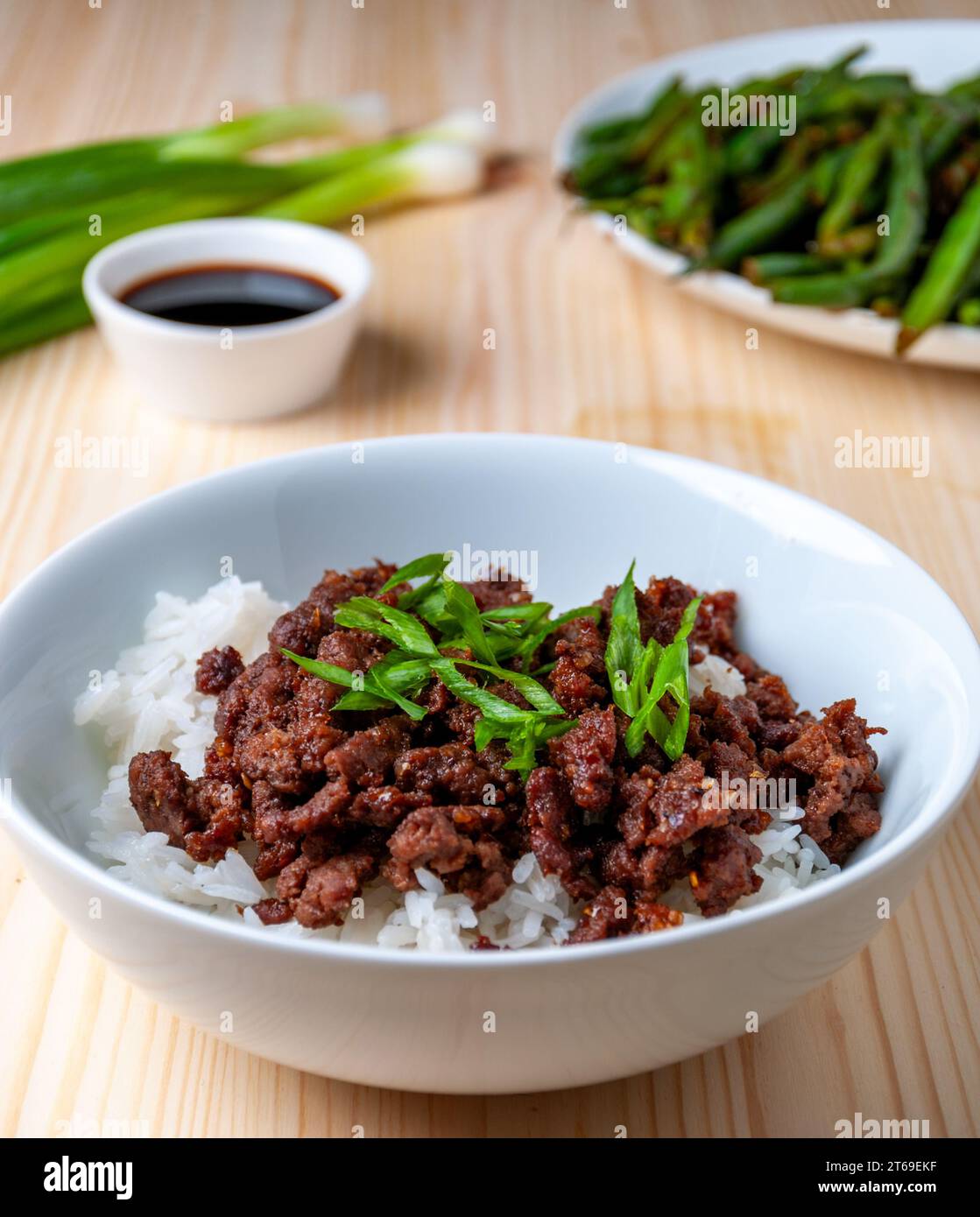 Korean Beef Served Over White Rice with Green Onions and Asian-Style ...
