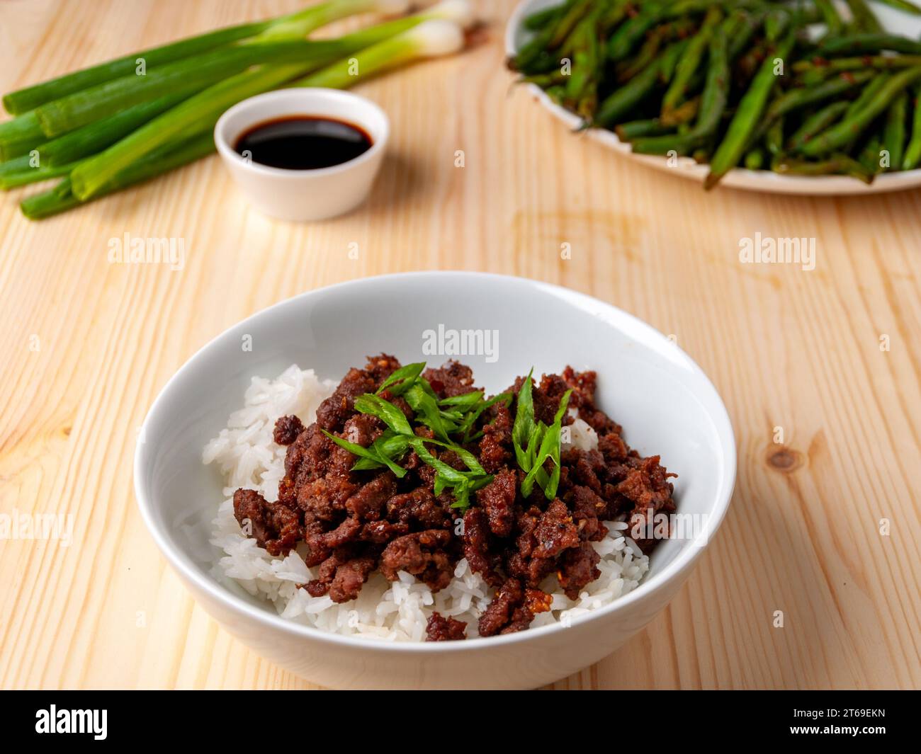 Korean Beef Served Over White Rice with Green Onions and Asian-Style ...