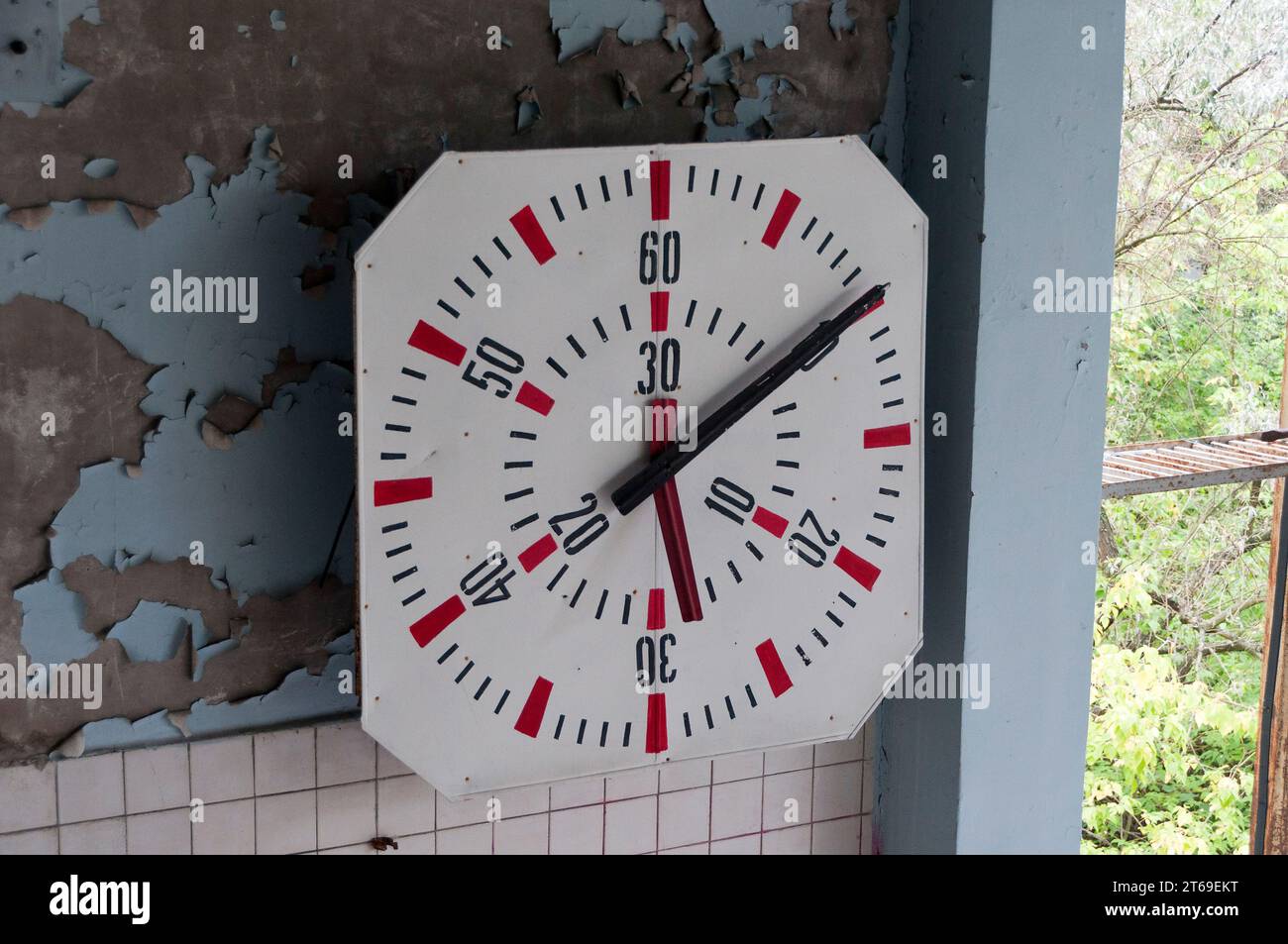 Large wall clock above the swimming pool in abandoned Pripyat near ...