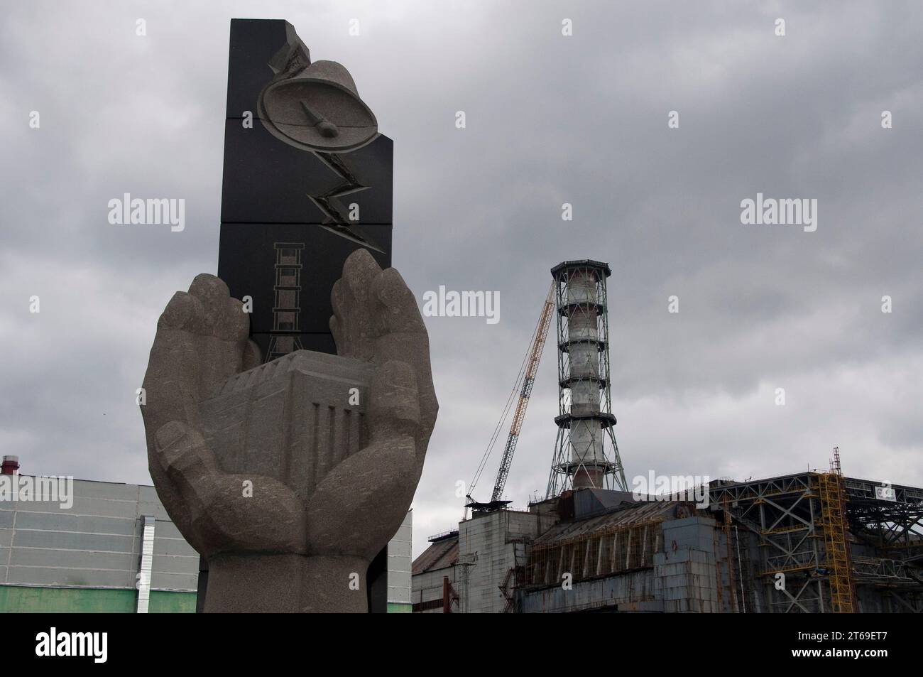 A monument to the Chernobyl nuclear disaster with reactor 4 in the ...