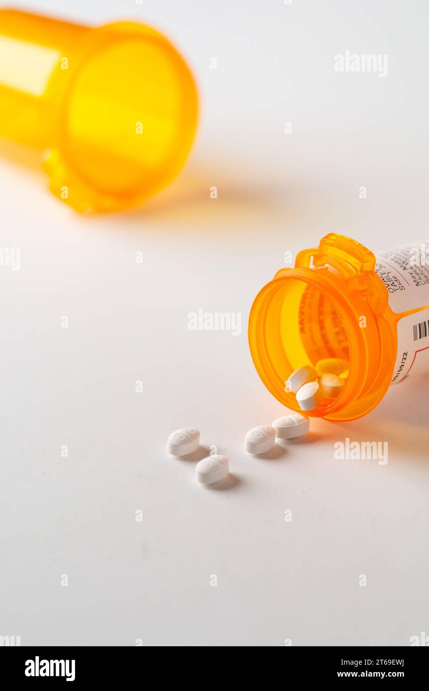 Prescription Pill Bottles Tipped Over with Pills Spilling Out and ...