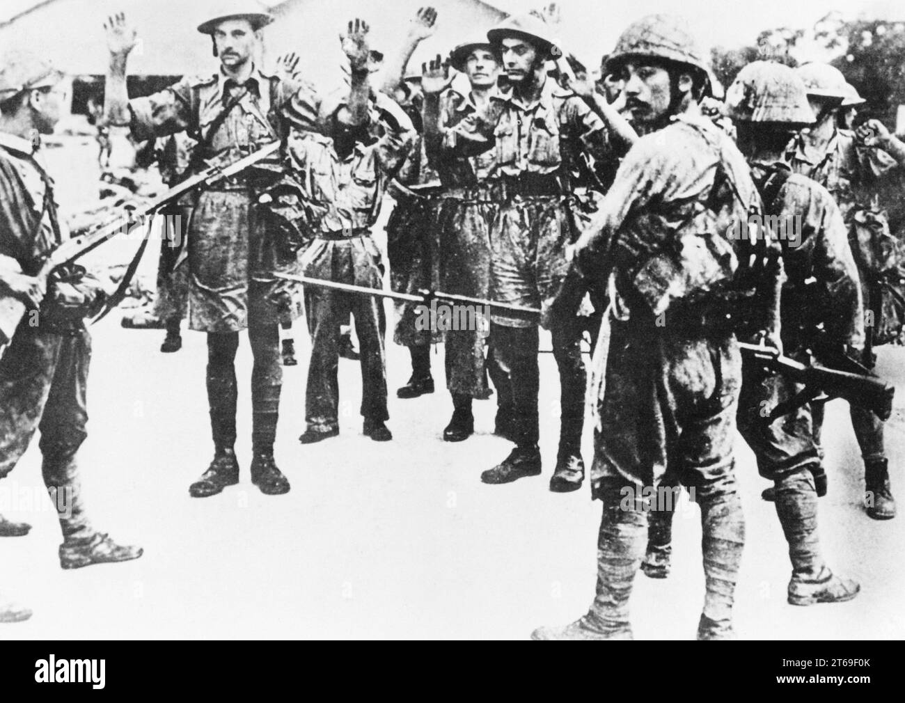 Japanese soldiers with captured British during the combats around ...