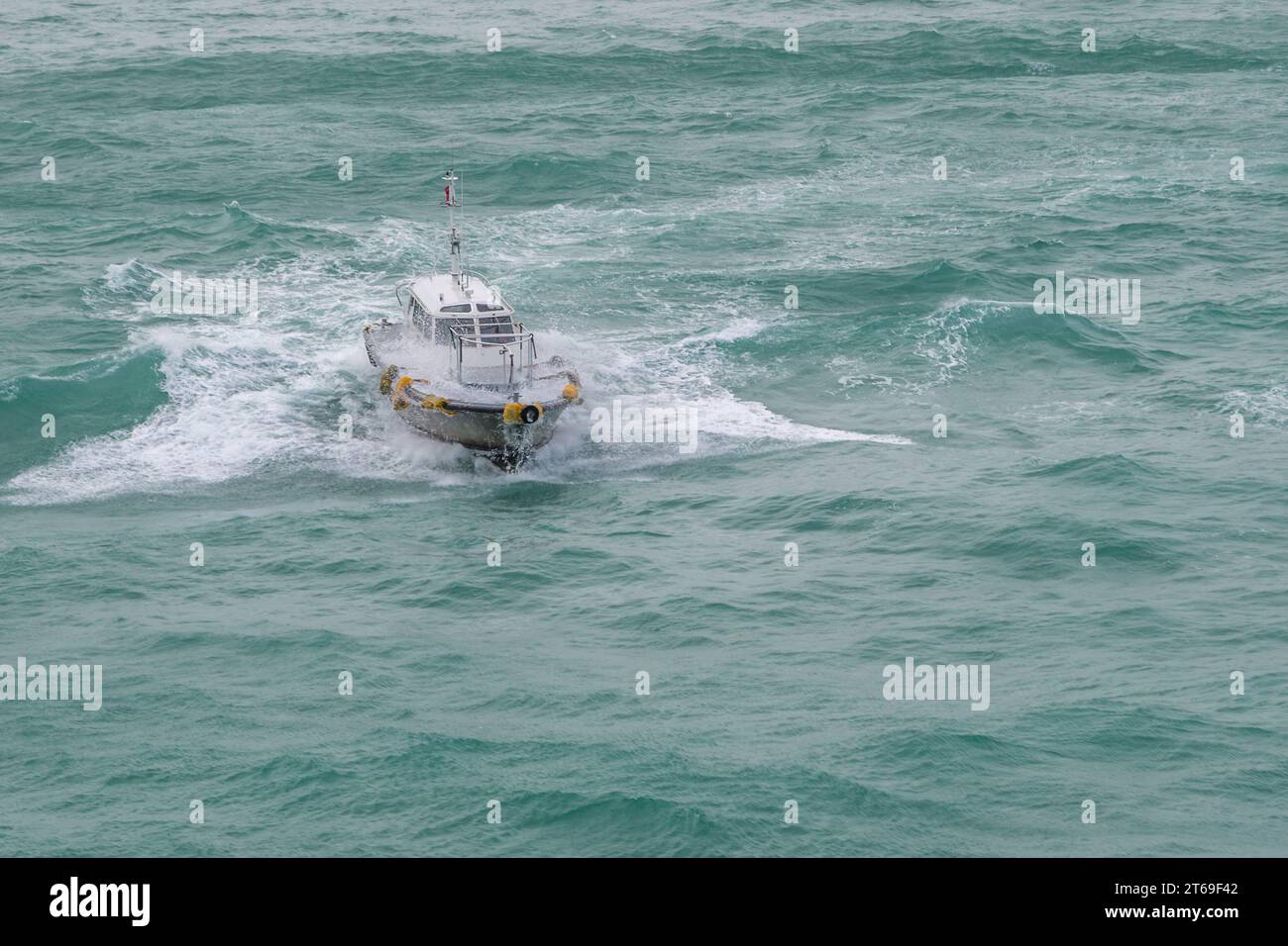 Pilot boat in the open Atlantic Ocean being positioned to take the ...