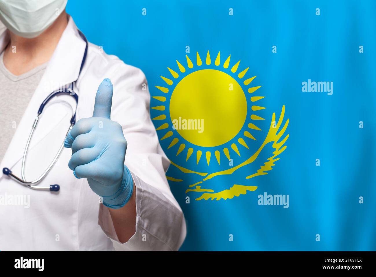 Kazakh doctor's hand showing thumb up positive gesture on flag of ...