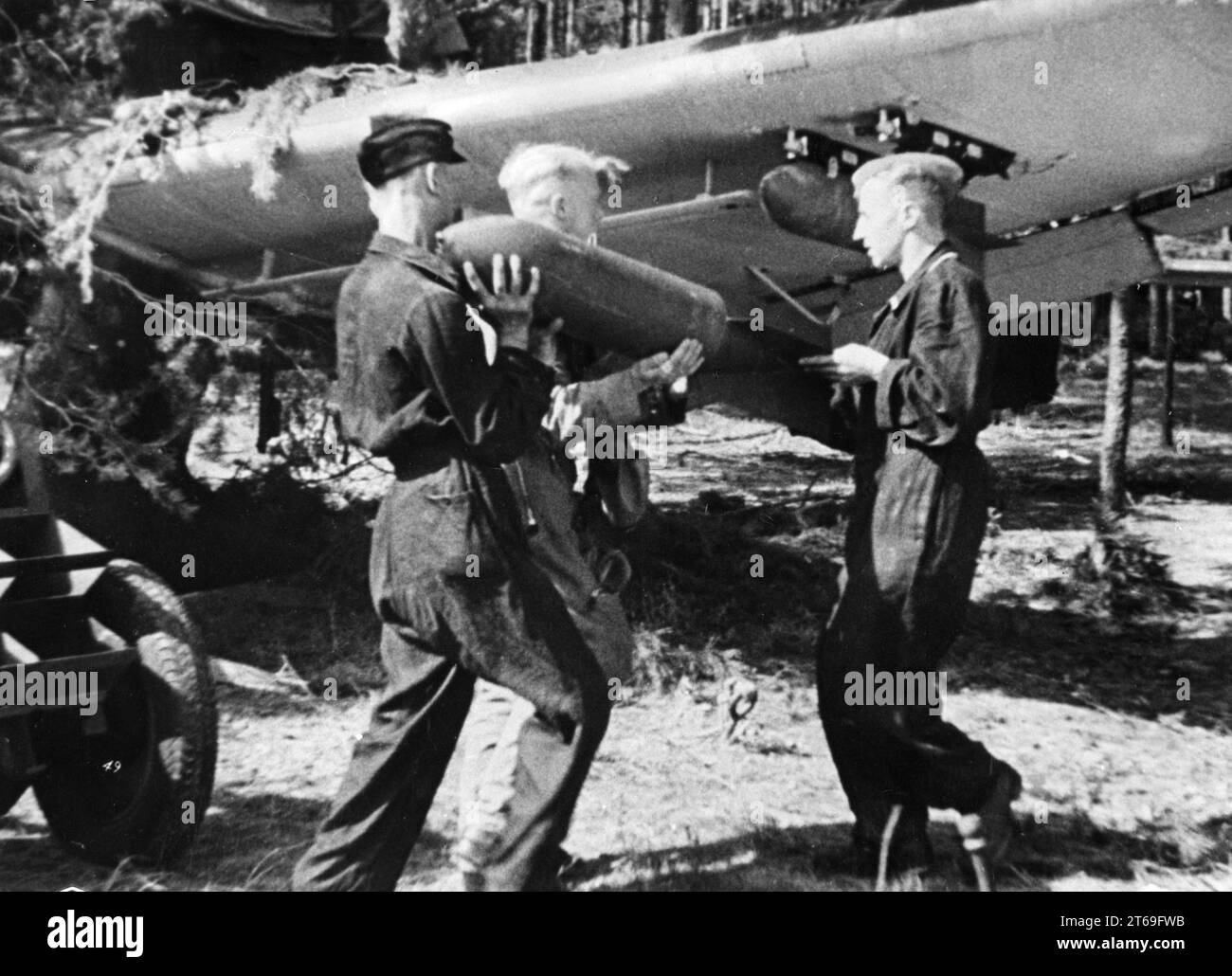 German Messerschmitt Me 110 is loaded with aerial bombs on the Eastern ...