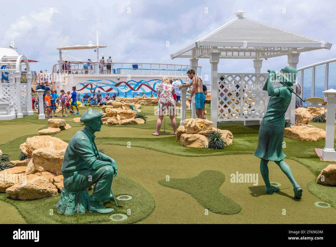 Cruise passengers playing miniature golf on the Royal Caribbean Allure ...