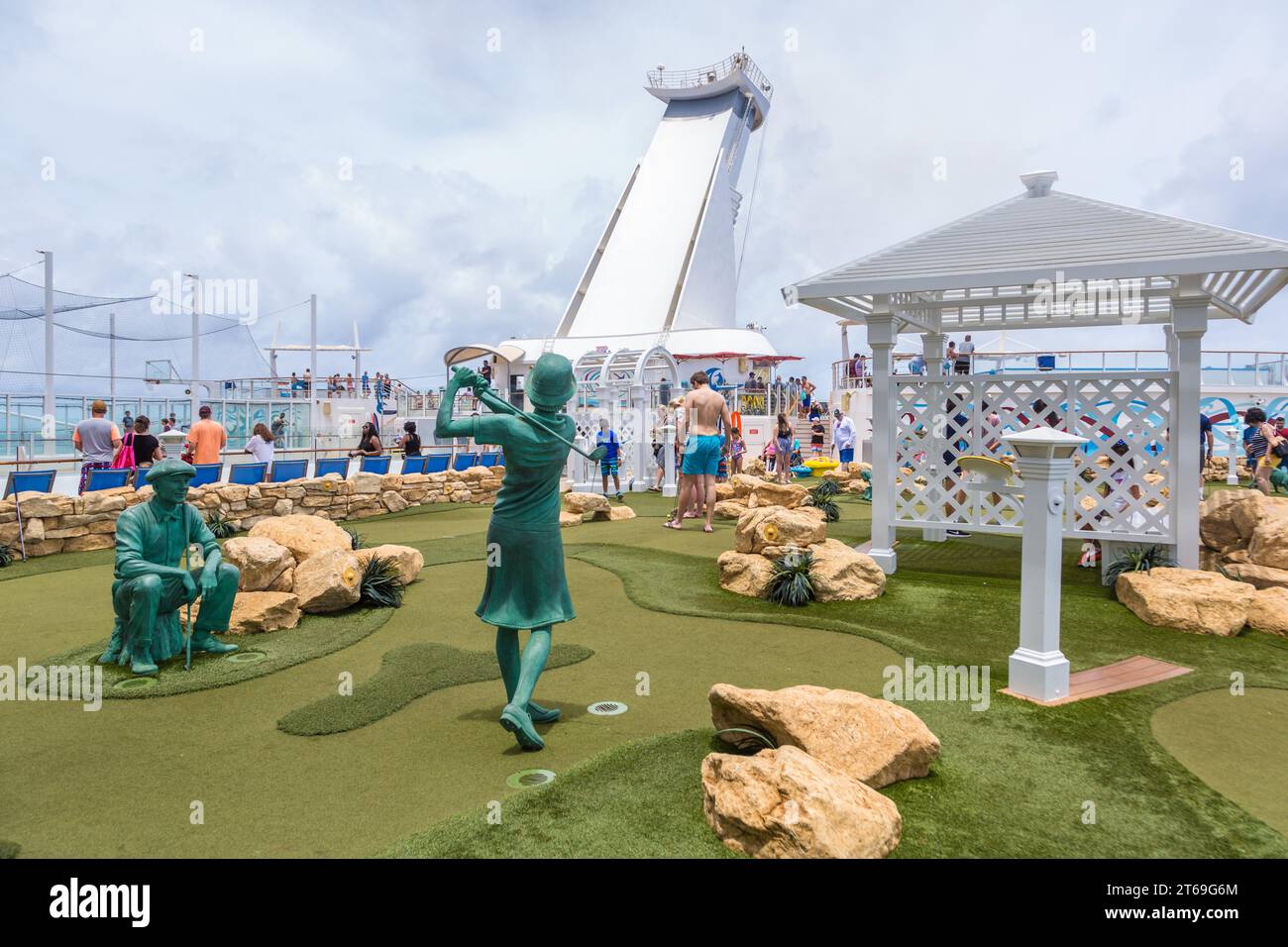 Cruise passengers playing miniature golf on the Royal Caribbean Allure ...