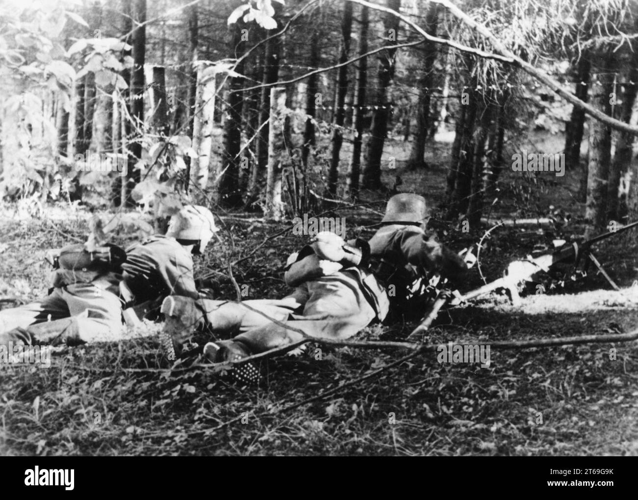 German soldiers in action in a forest in Lithuania. Photo: Schmidt ...