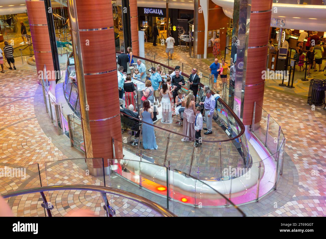Cruise passengers minglling at the Rising Tide Bar on the Royal ...