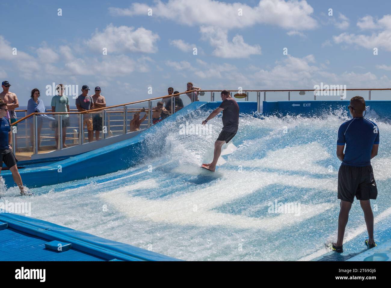 Man surfing at the Flowrider activity on the Royal Caribbean Allure of ...