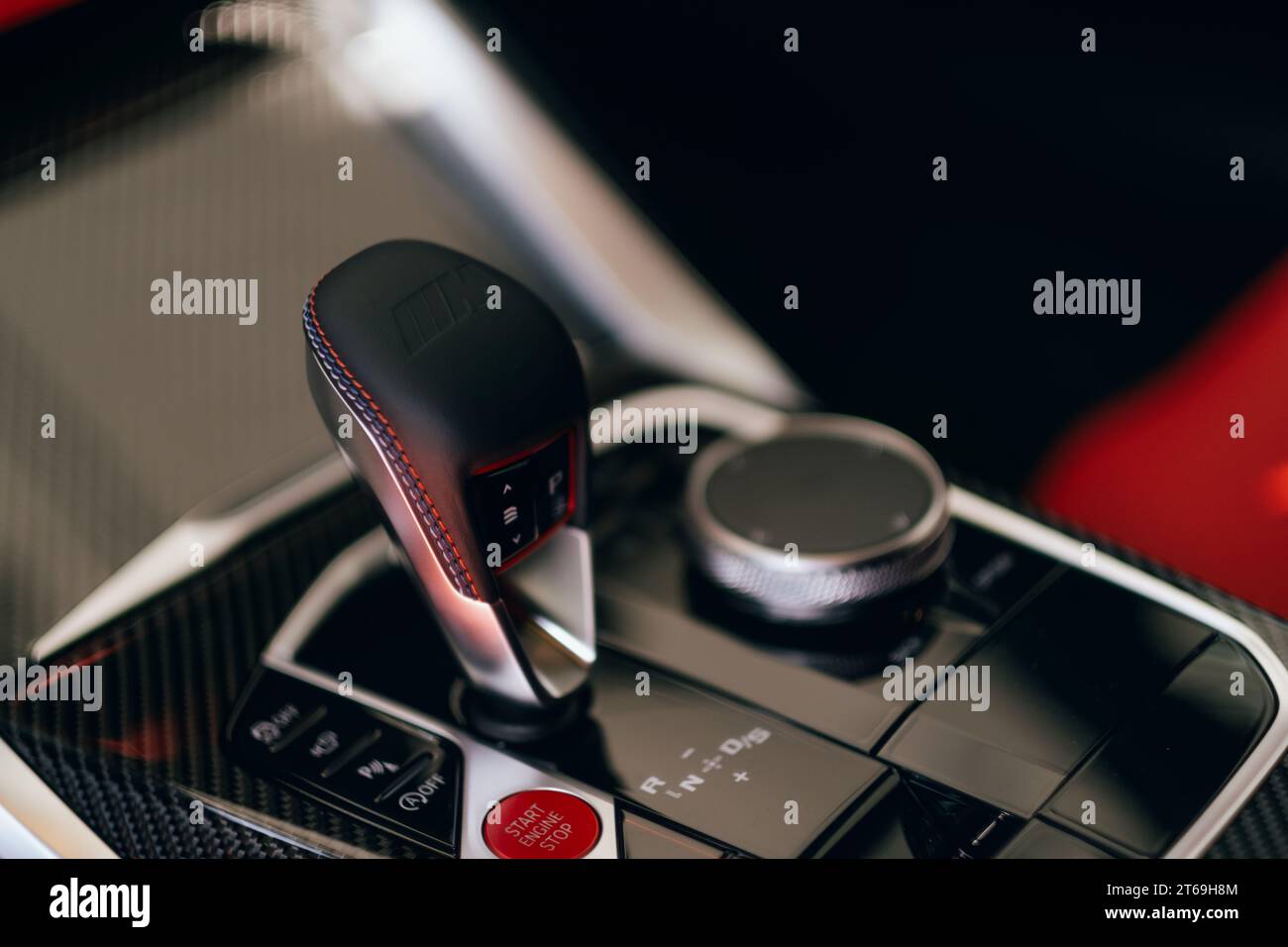 A close-up of a gear shift lever located in the dashboard of a vehicle ...