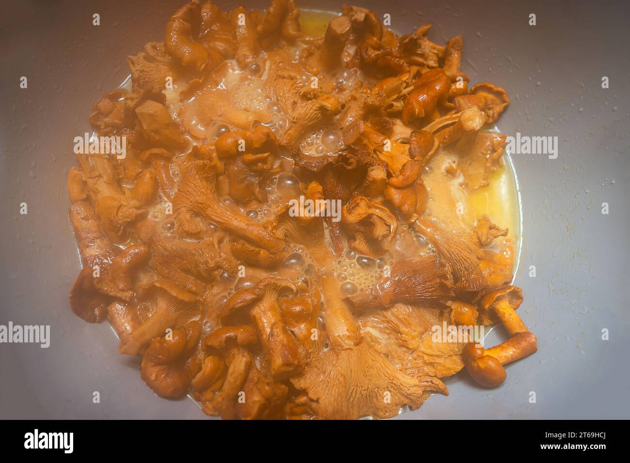 Close up of Chanterelle Mushrooms cooking in a pan of butter Stock ...