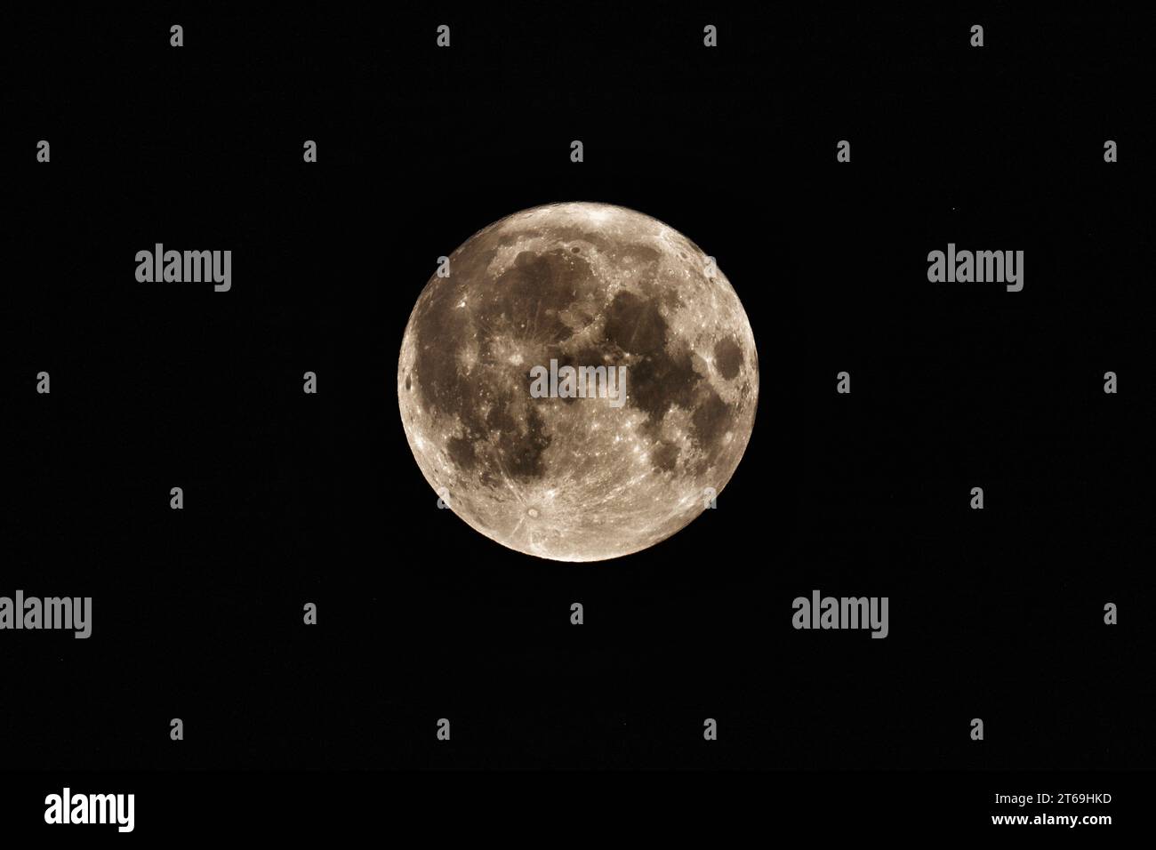 A stunning view of a full moon glowing in the night sky Stock Photo - Alamy