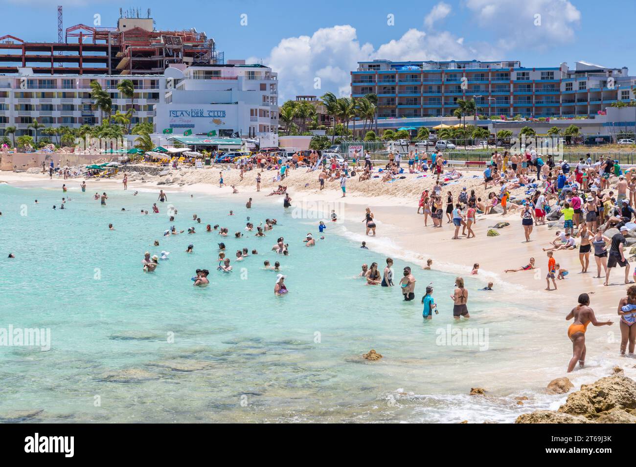 Tourists at Maho beach on the island of St. Maarten in the Caribbean ...