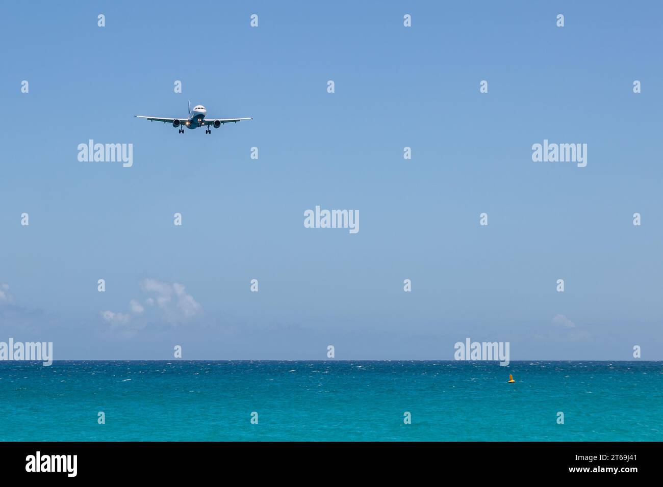 Commercial airliner on final approach to the Princess Juliana ...