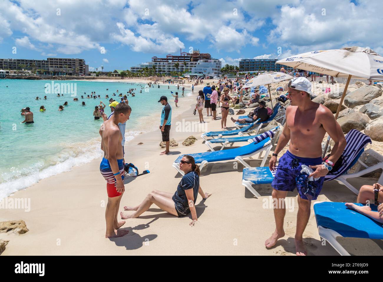 Tourists at Maho beach on the island of St. Maarten in the Caribbean ...
