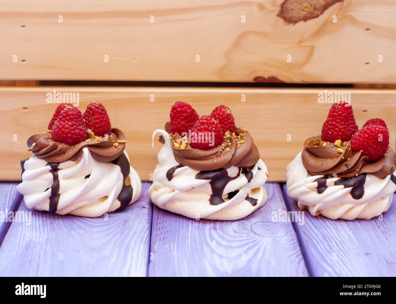 Mini cakes with whipped cream, chocolate, meringue and fresh ...