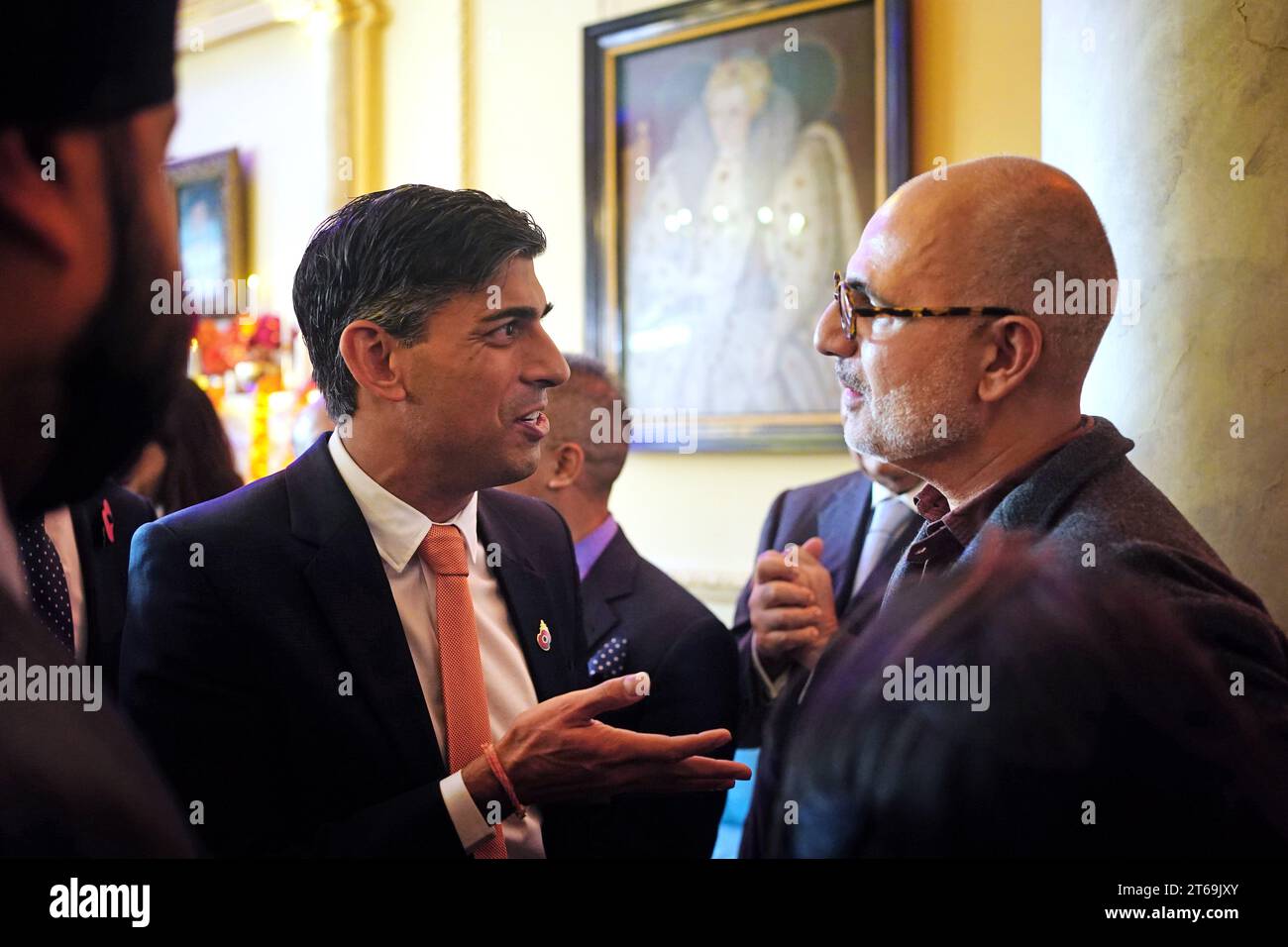 Prime Minister Rishi Sunak (left) speaks to Shamil Thakrar, co-founder ...