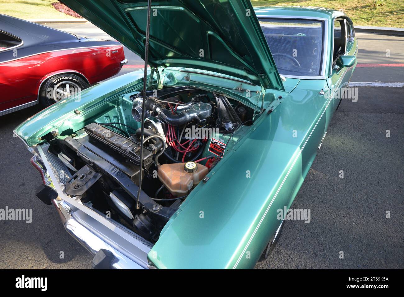 Vintage automobile on display at vintage car fair with open engine ...