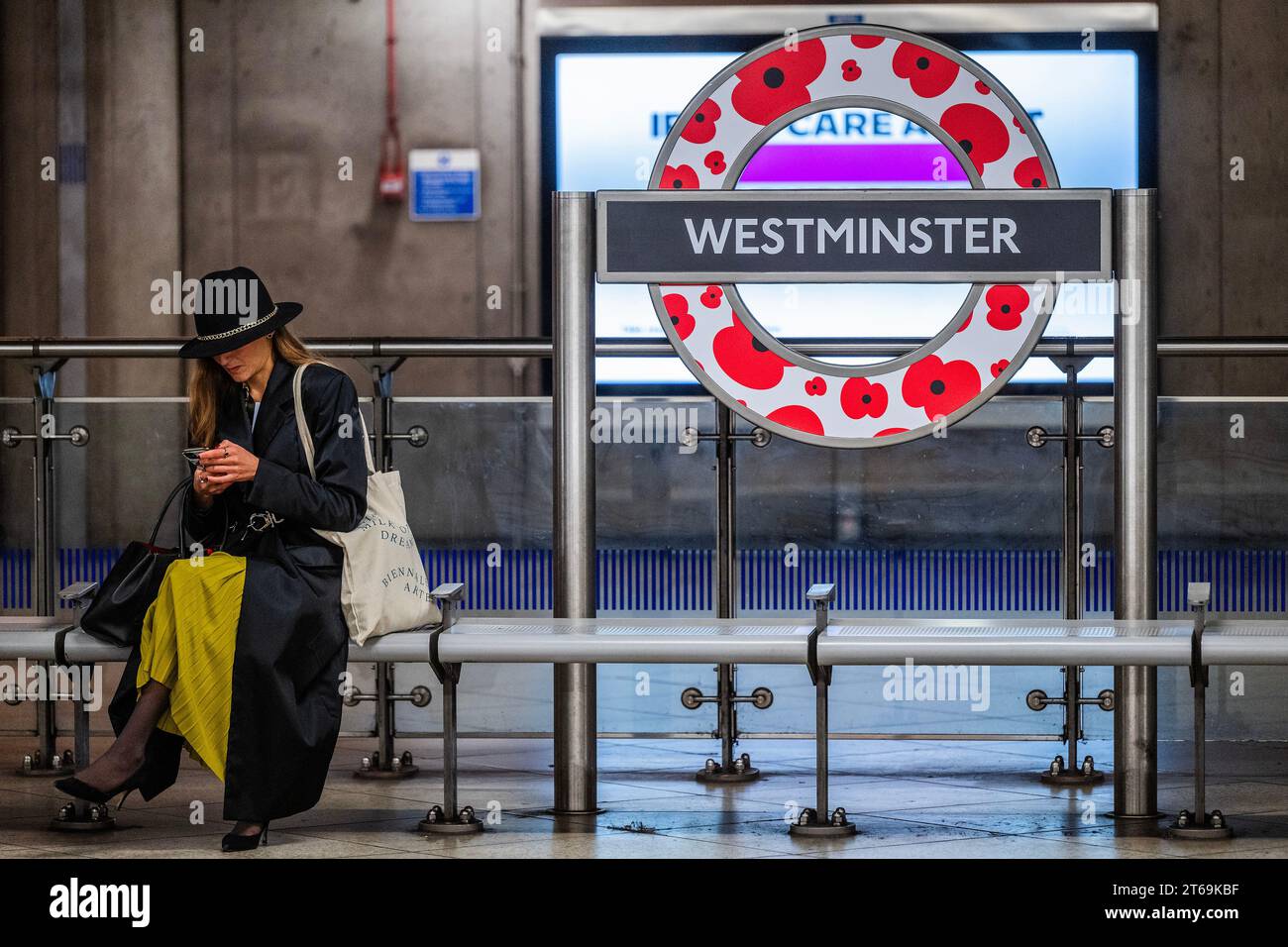 London, UK. 9th Nov, 2023. Poppies on a Station sign for remembrance at Westminster Underground ...