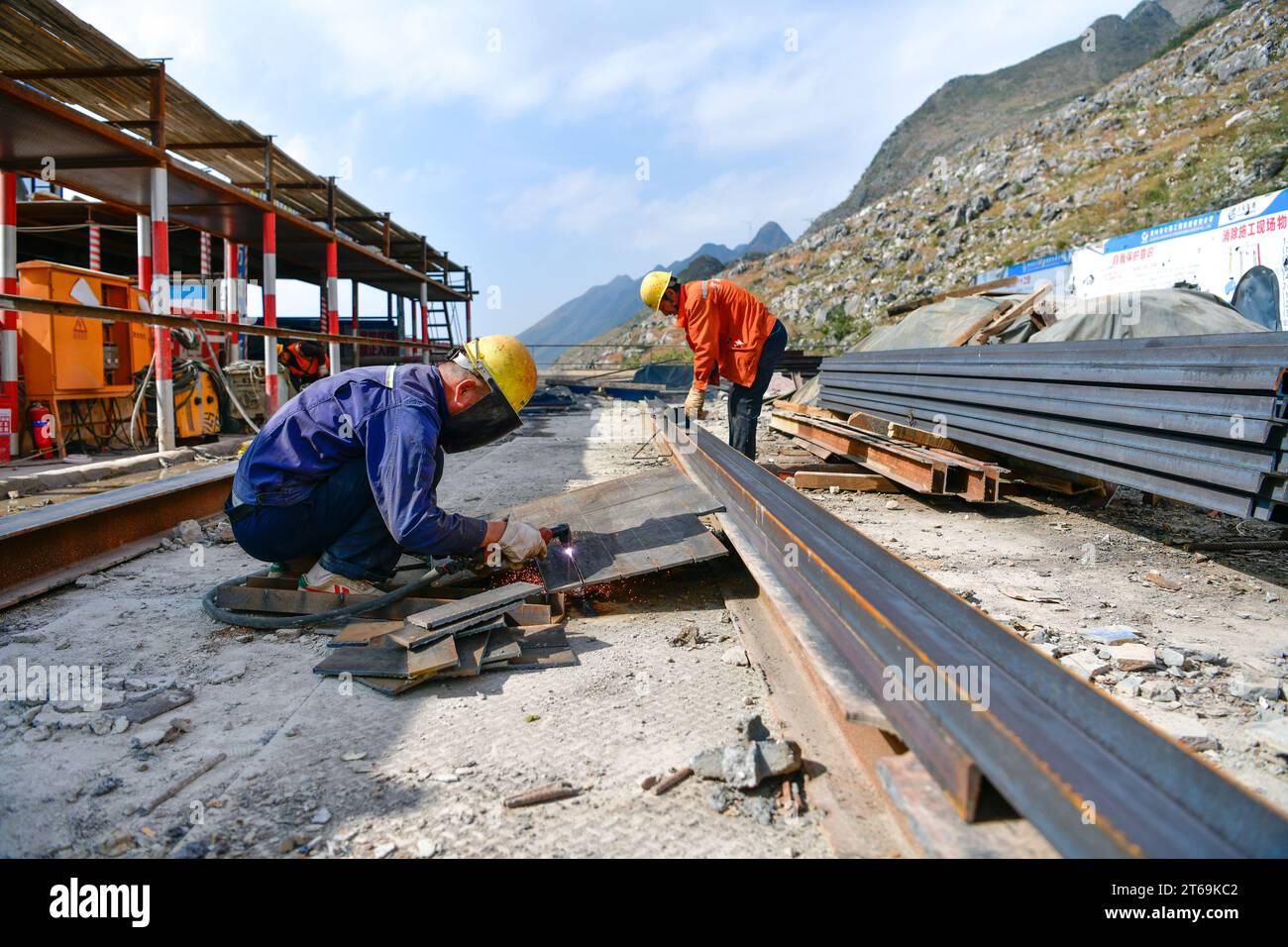 Guanling. 7th Nov, 2023. Workers are pictured at the construction site ...