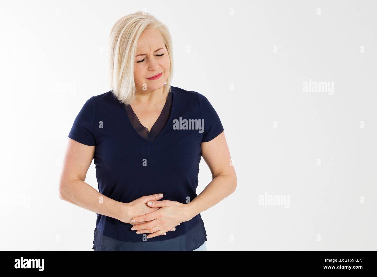 female abdominal pain isolated copy space close up Stock Photo - Alamy