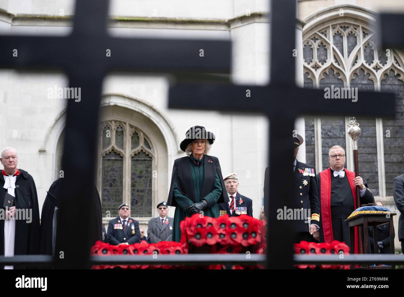 Queen Camilla stands in front of the Cross of Remembrance during a ...