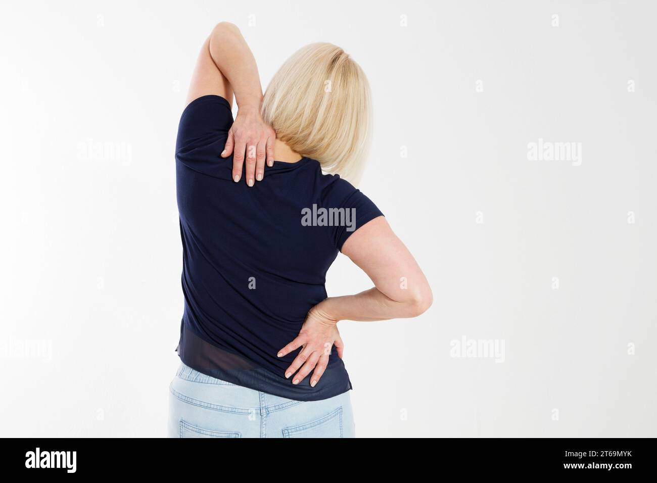 Adult woman has a backache. Mature female has pain in back, female back ...