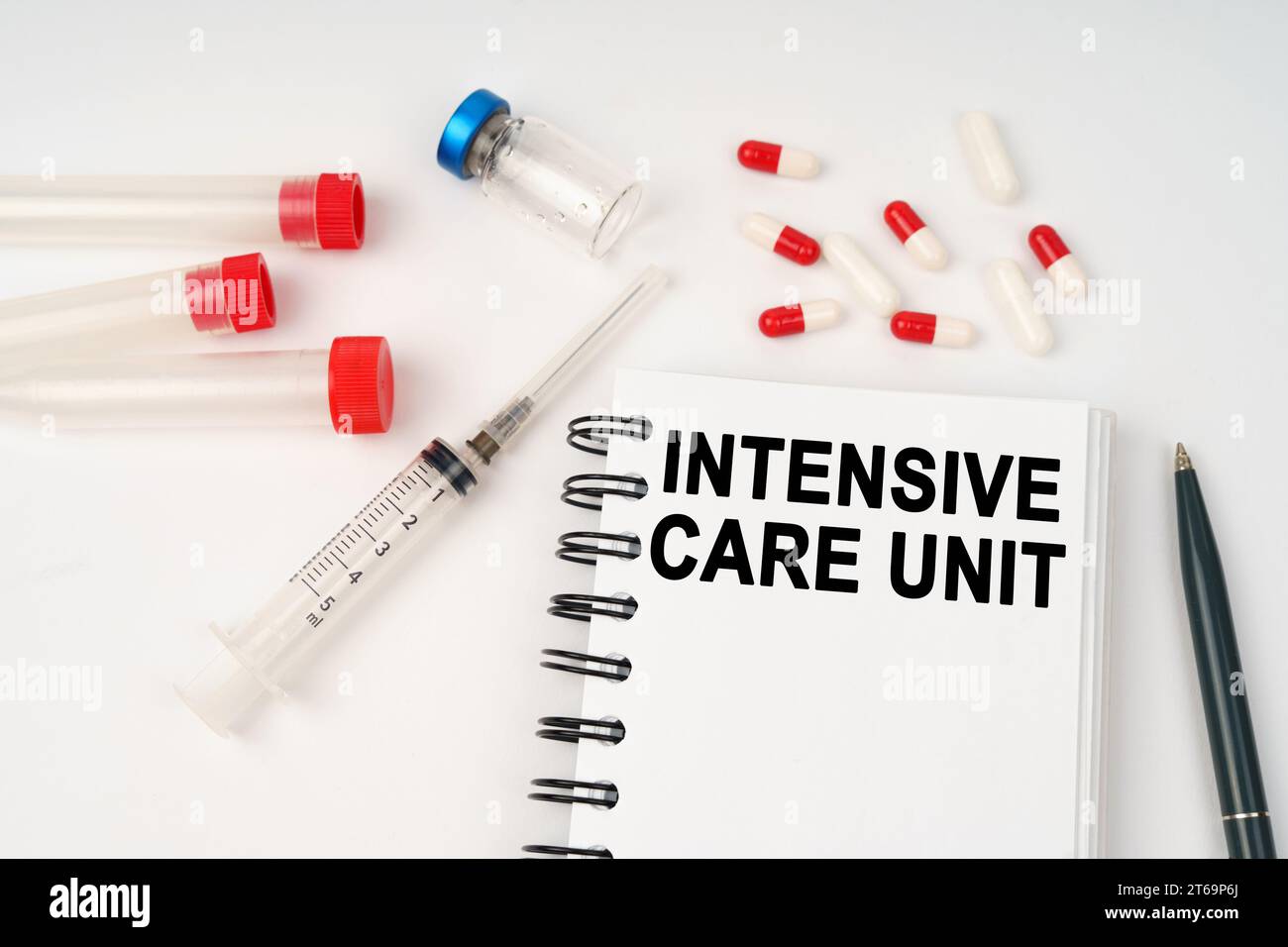 Medical concept. On the table are pills, injections, a syringe and a ...