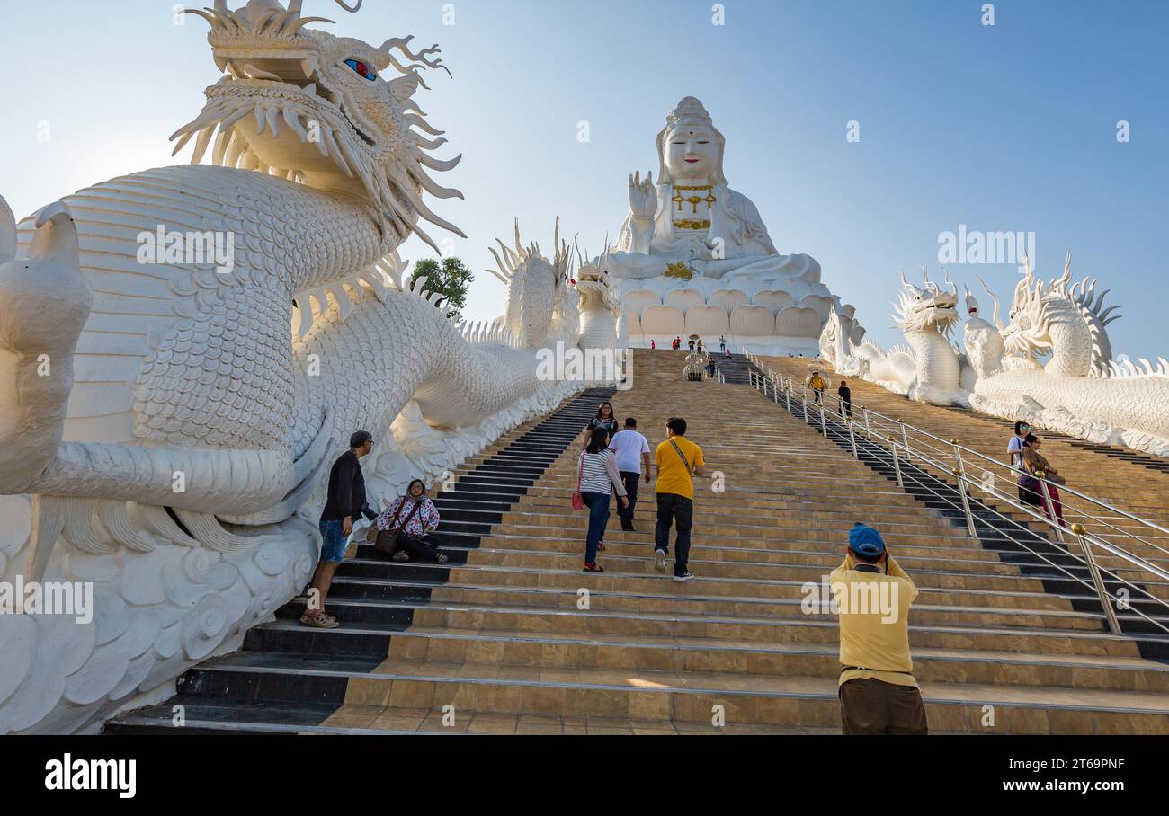 Visitors ascend the steps up to the Guan Yin (Goddess of Mercy) statue ...