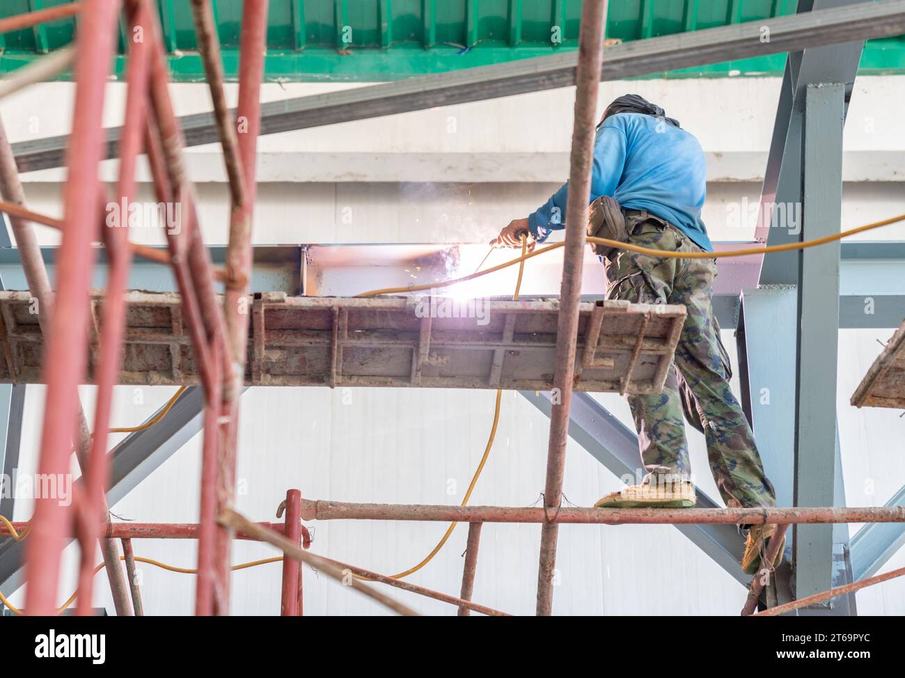 Worker welding beam at hight building without safty device ptotection ...