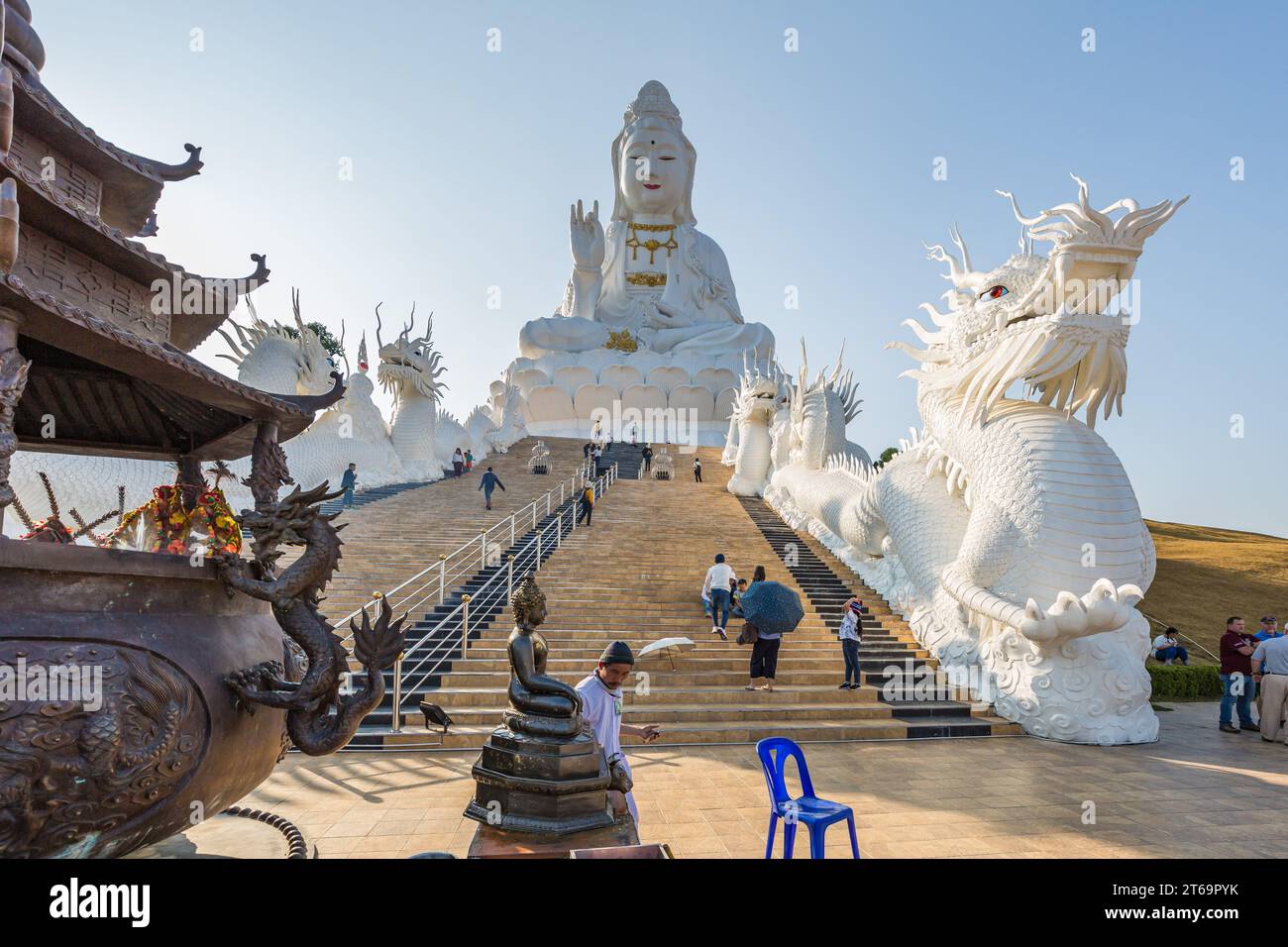 Worker cleaning Buddhist statue at the Guan Yin (Goddess of Mercy ...
