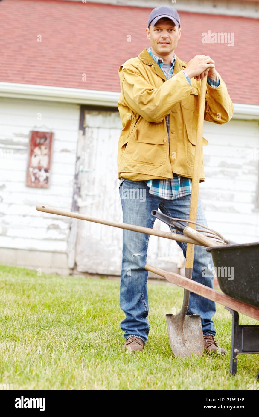 Almost time to start digging. Portrait of a happy man standing next to ...