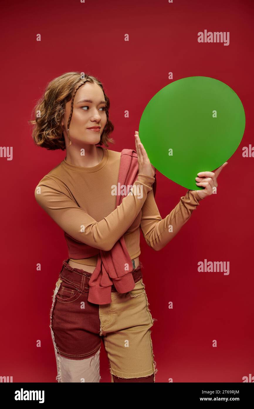 pretty woman in patchwork pants and jumper over cropped long sleeve ...