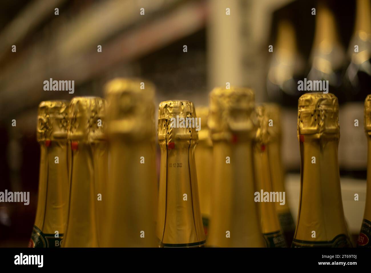 Champagne bottles. Gold foil on bottle. Alcohol in store. Champagne ...
