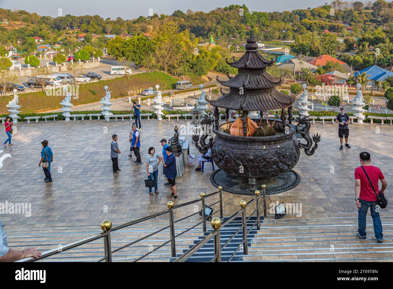 Offering pot at the base of the Guan Yin (Goddess of Mercy) statue at ...