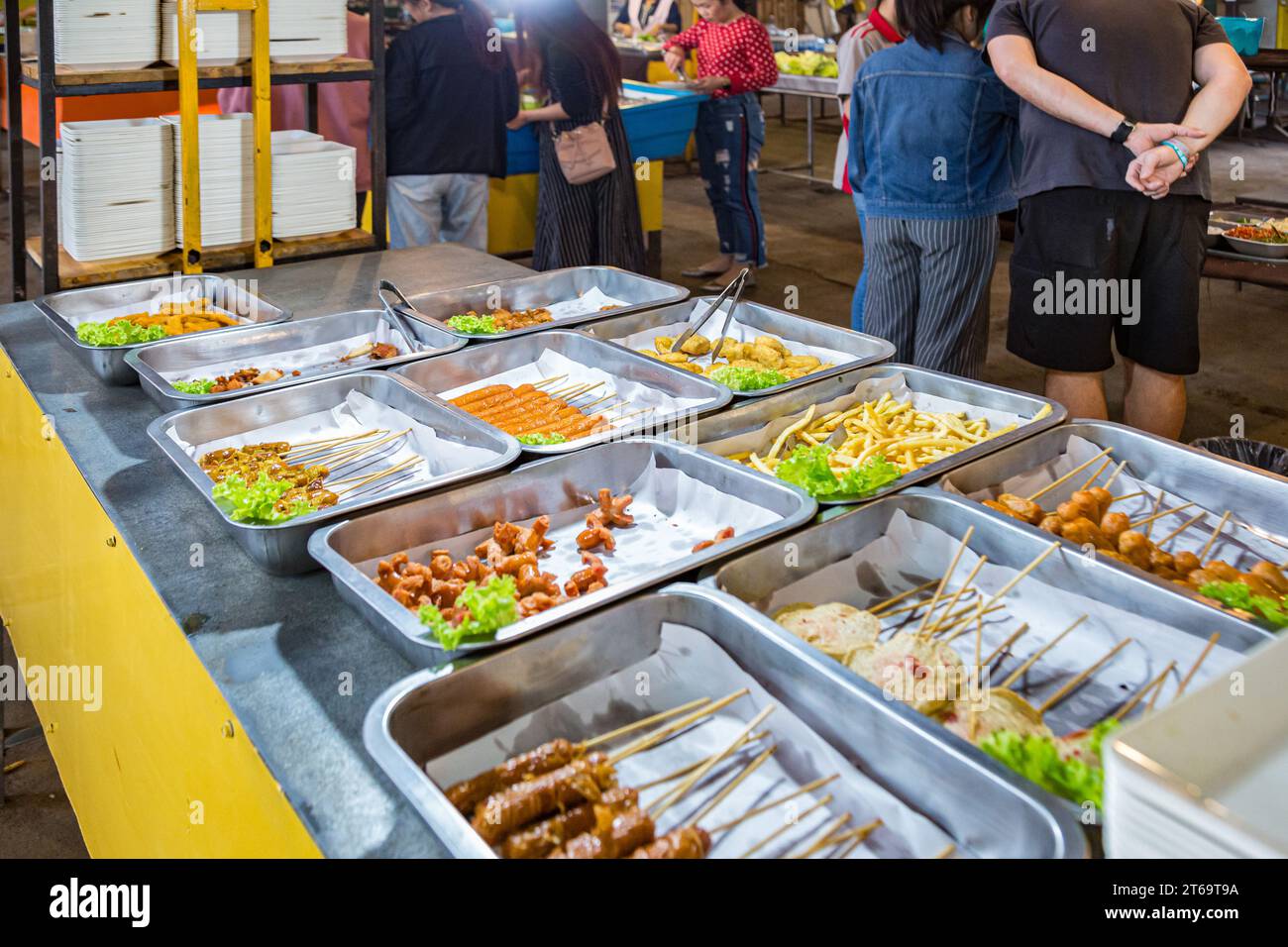 Selection of prepared foods available for customers at a buffet style ...