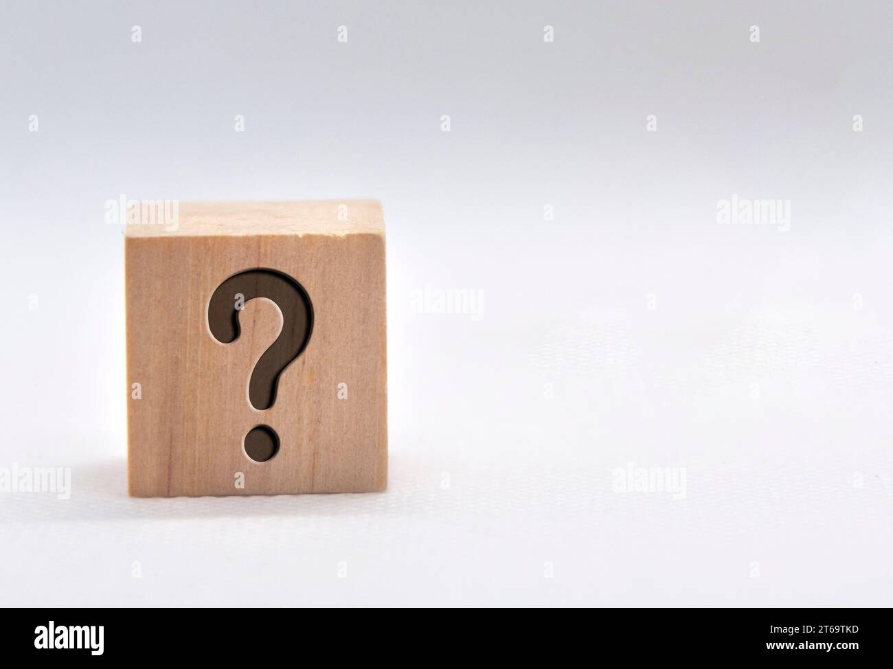 Question mark on wooden cube on white background Stock Photo - Alamy