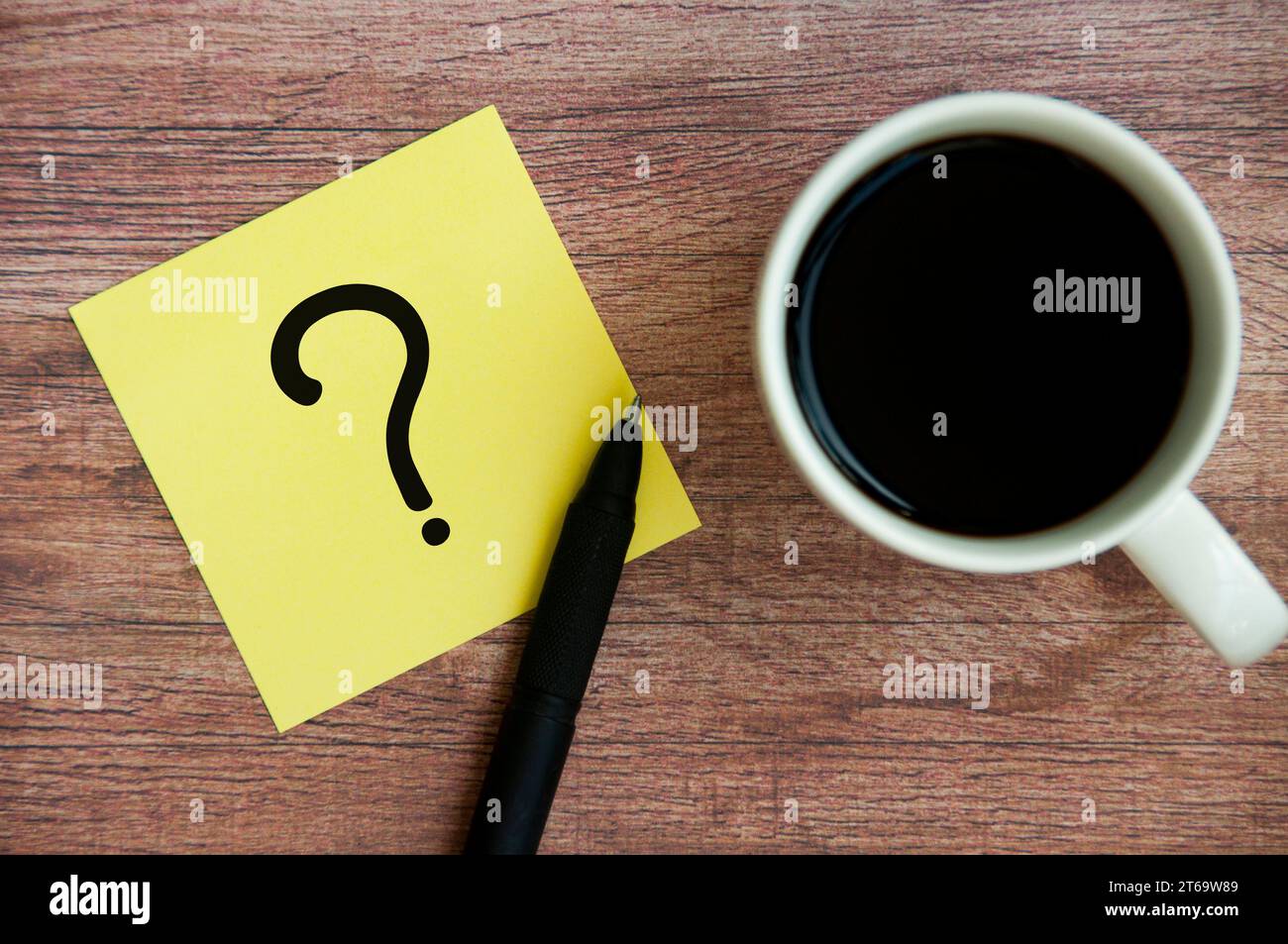 Top view of question mark on notepad with pen on coffee. Question and ...