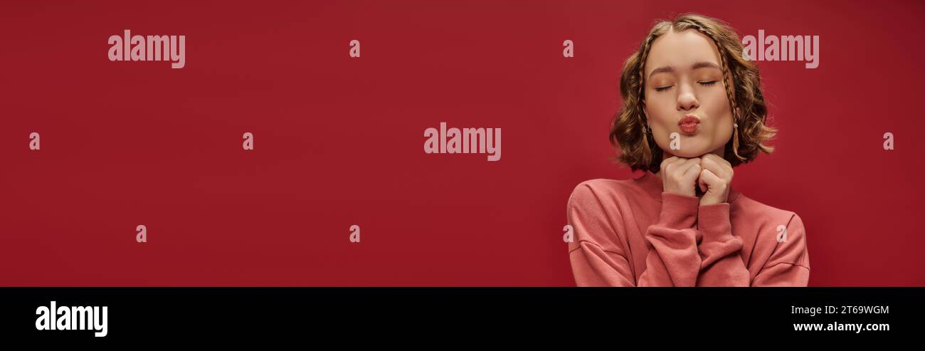 portrait of young pretty woman with short wavy hair and braids pouting ...