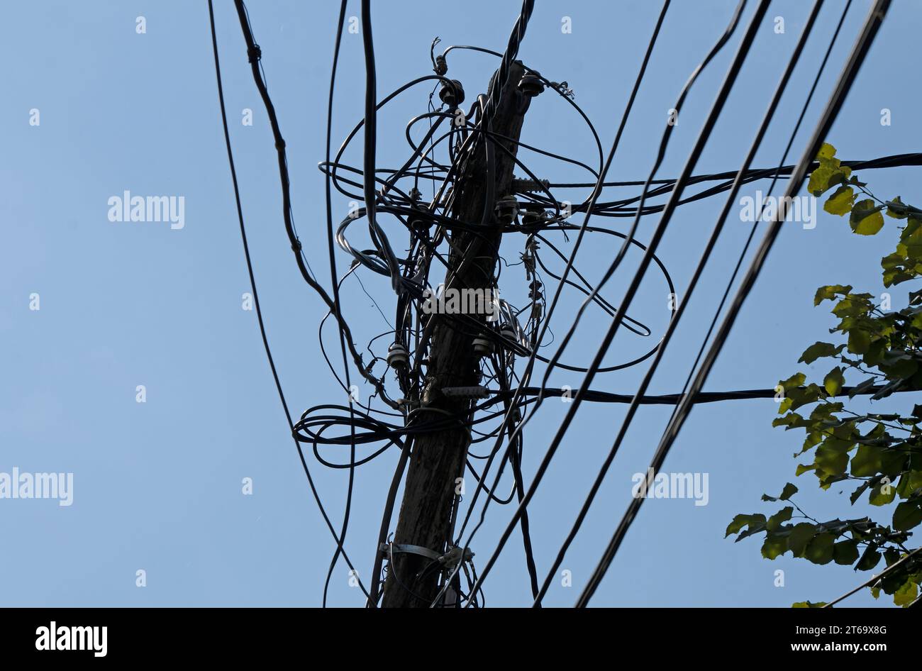 Entangled power lines attached to a pole in North Macedonia Stock Photo ...