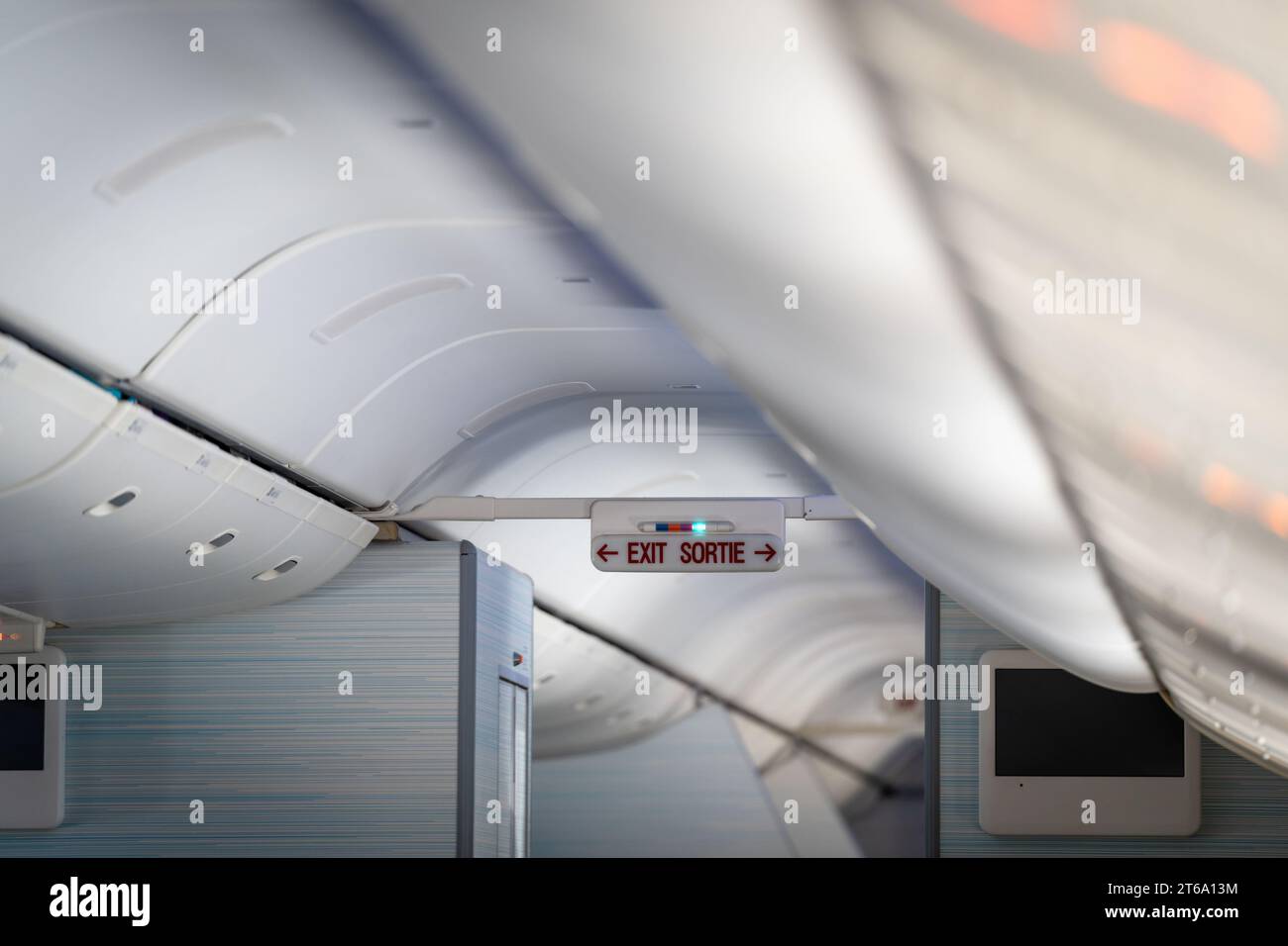 Exit sign lightbox in passenger airplane, escape way of life. way to ...