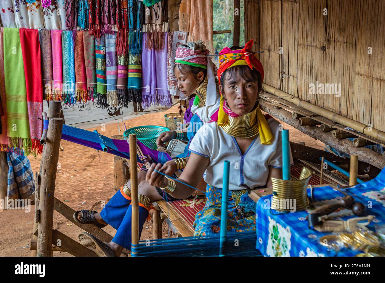 Tribal women weaving scarves in the Long Neck Karen tribe (Kayah Lahwi ...