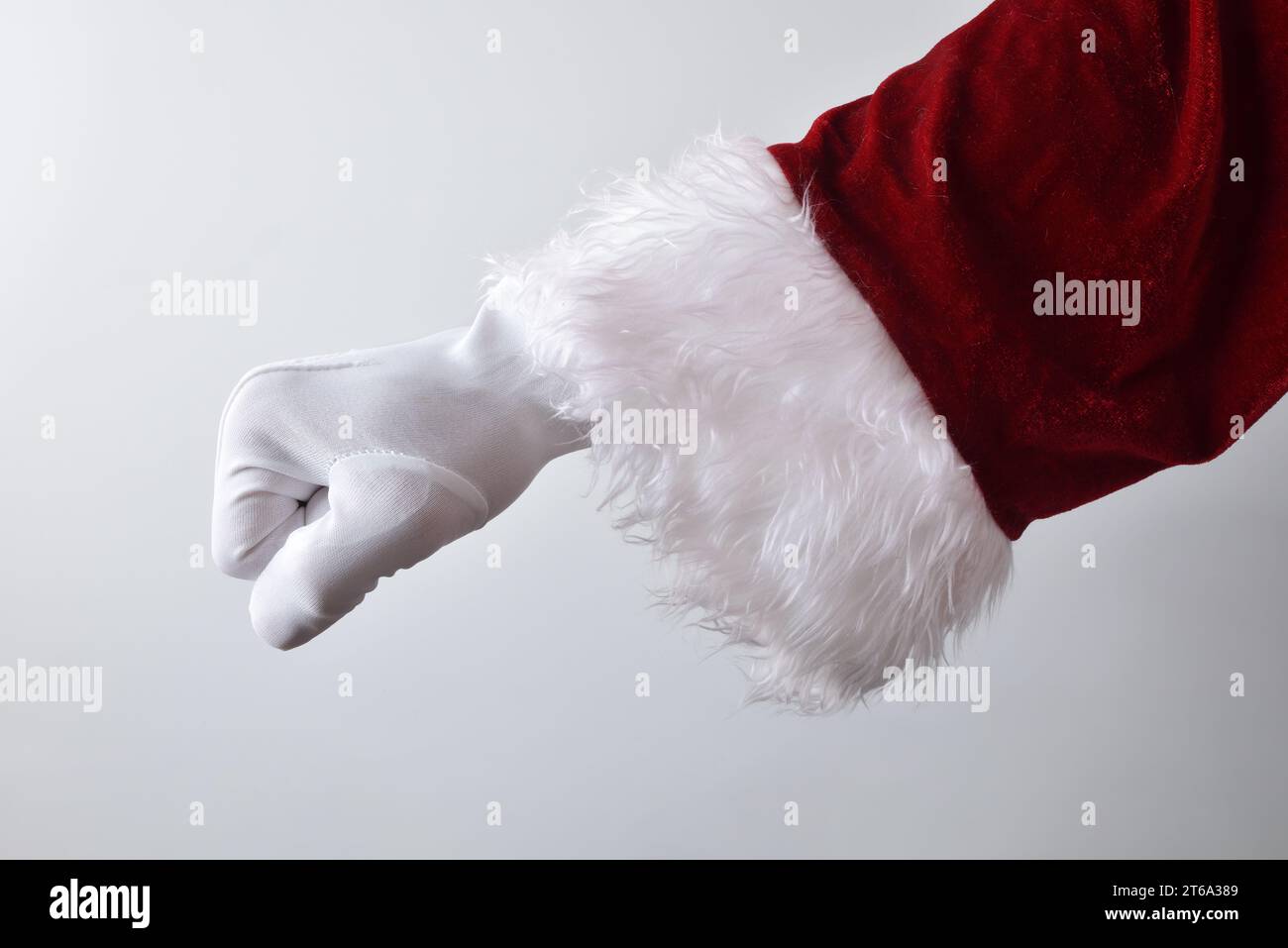 Detail of santa claus hand with clenched fist upside down in hitting ...