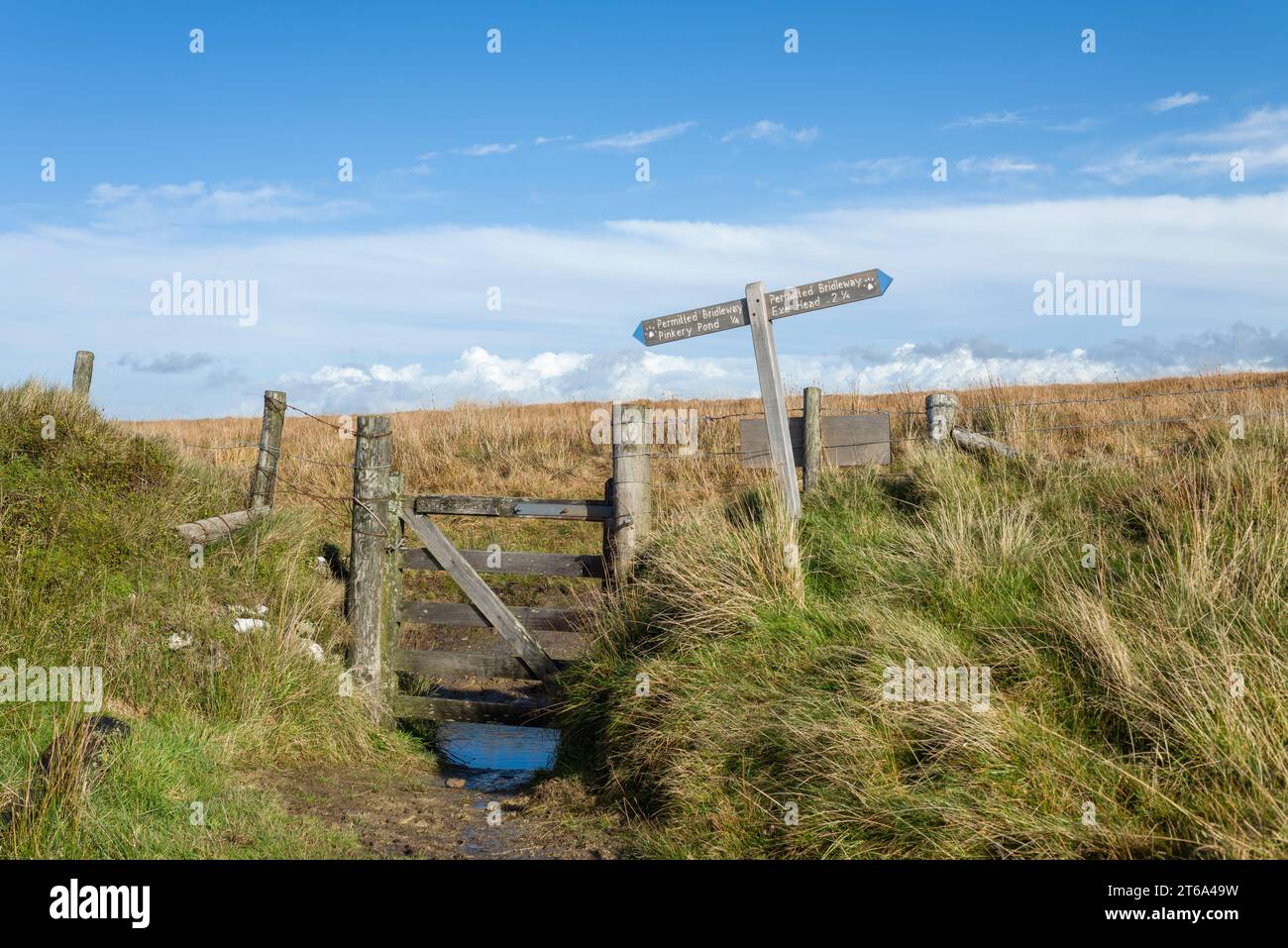 A signpost and gate on the Tarka Trail walking route between Exe Head ...