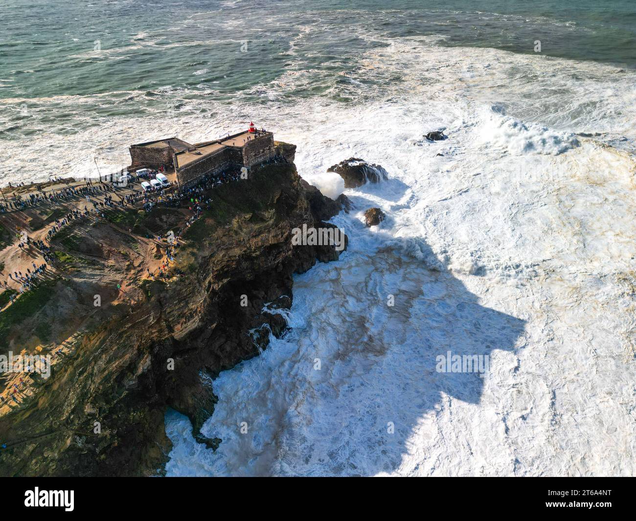 This stunning aerial shot features an idyllic coastal scene, with a ...