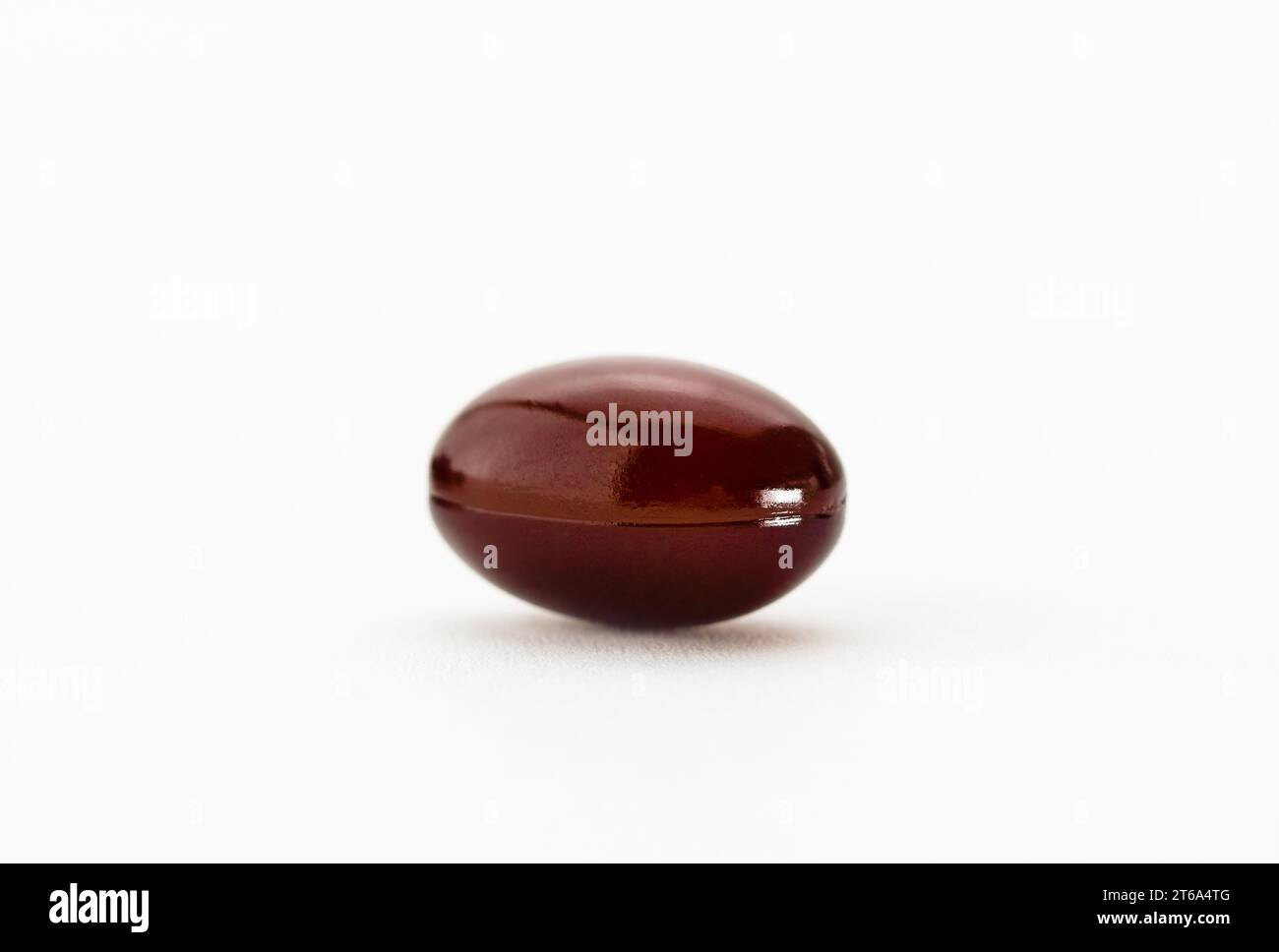 One red pill capsule, analgesic, painkiller drug, medicine gel capsule ...