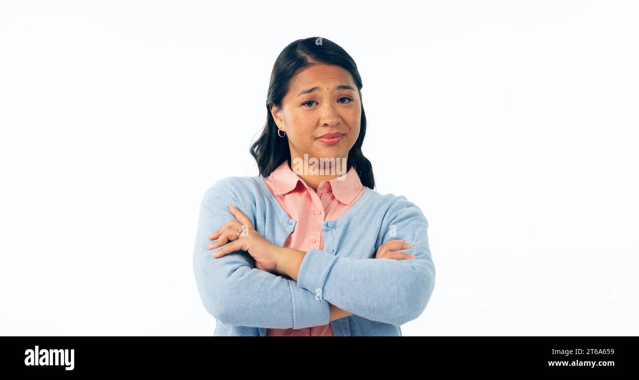 Portrait, attitude and an asian woman arms crossed in studio isolated ...
