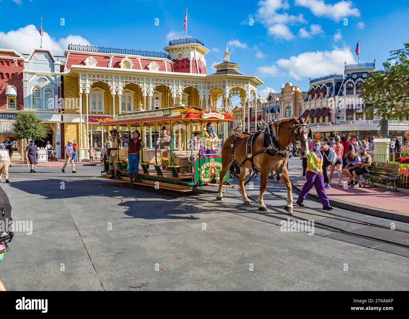 Horse pulling trolley car with Disney characters down Main Street in ...